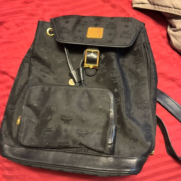 MCM | Bags | Authentic Mcm Embossed Logo Black Backpack | Poshmark